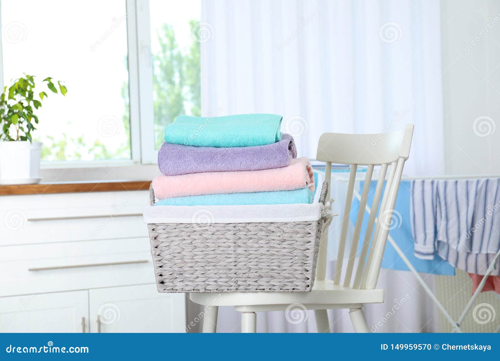 Basket with Clean Laundry on Chair Stock Photo - Image of container ...