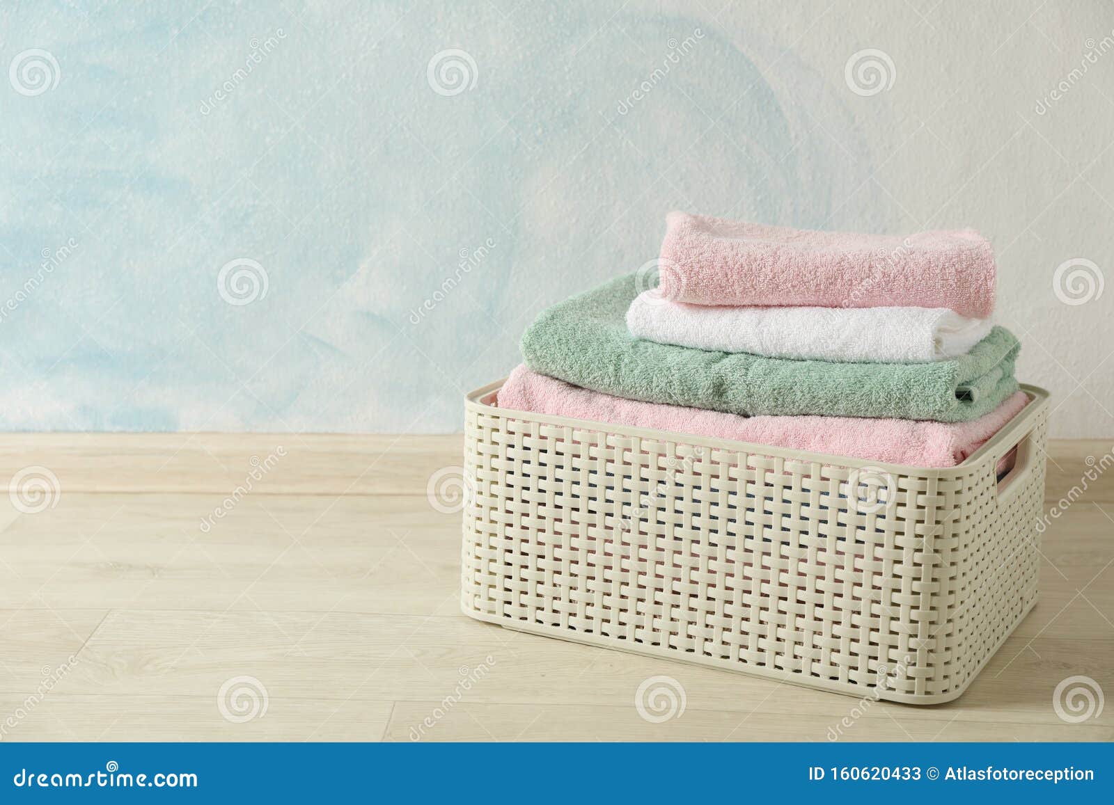 Basket with Clean Laundry on Textured Floor Stock Image - Image of ...