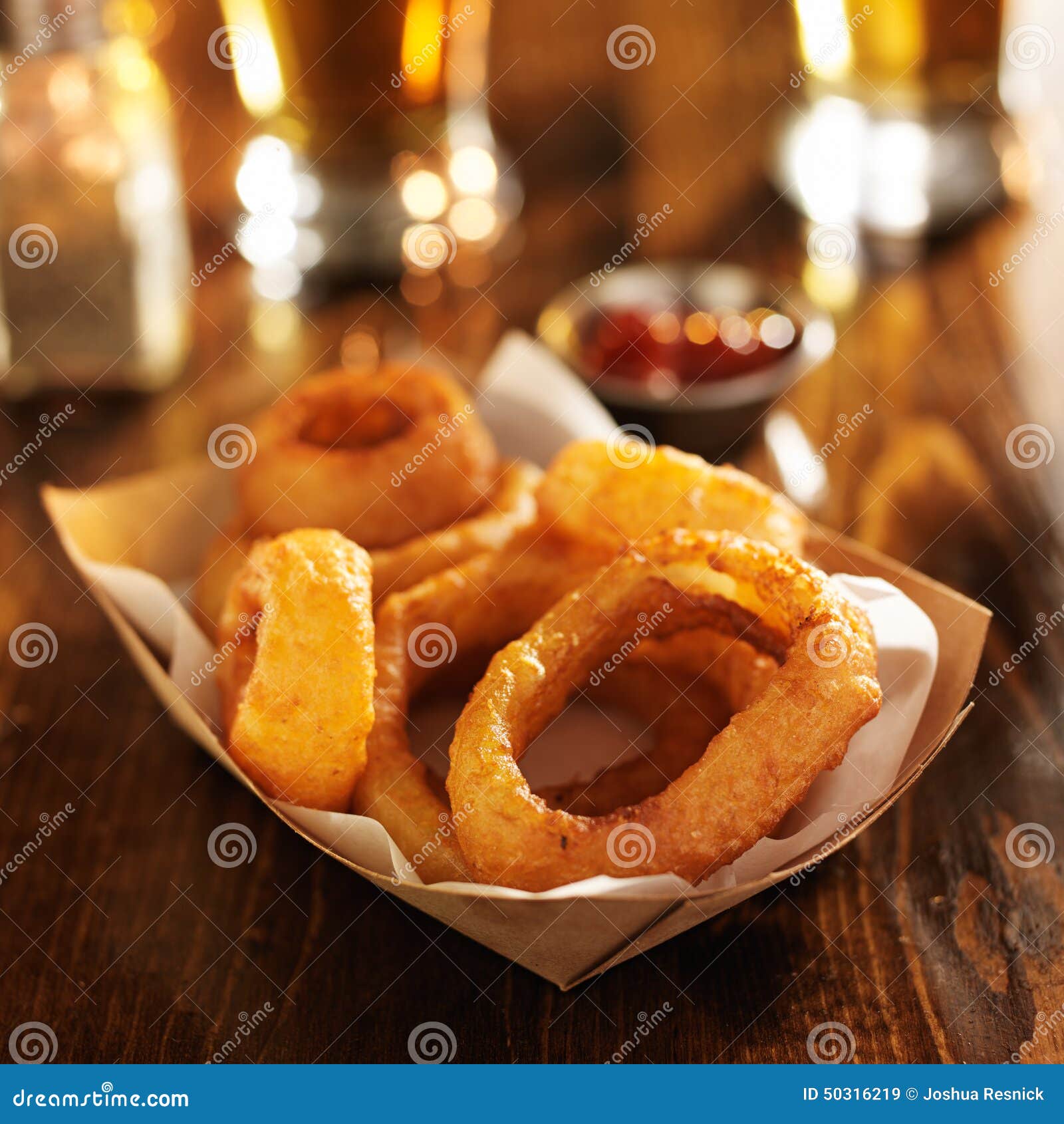 Basket of Crispy Onion Rings with Beer Stock Image - Image of onion ...
