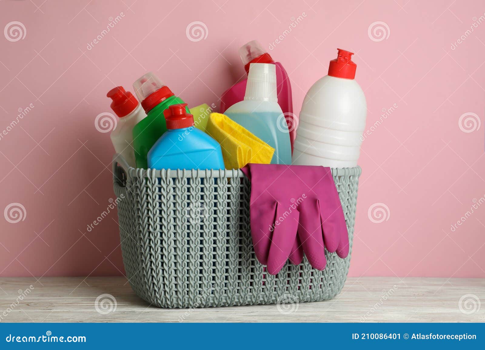 Basket with Different Cleaning Tools on Pink Background Stock Image ...