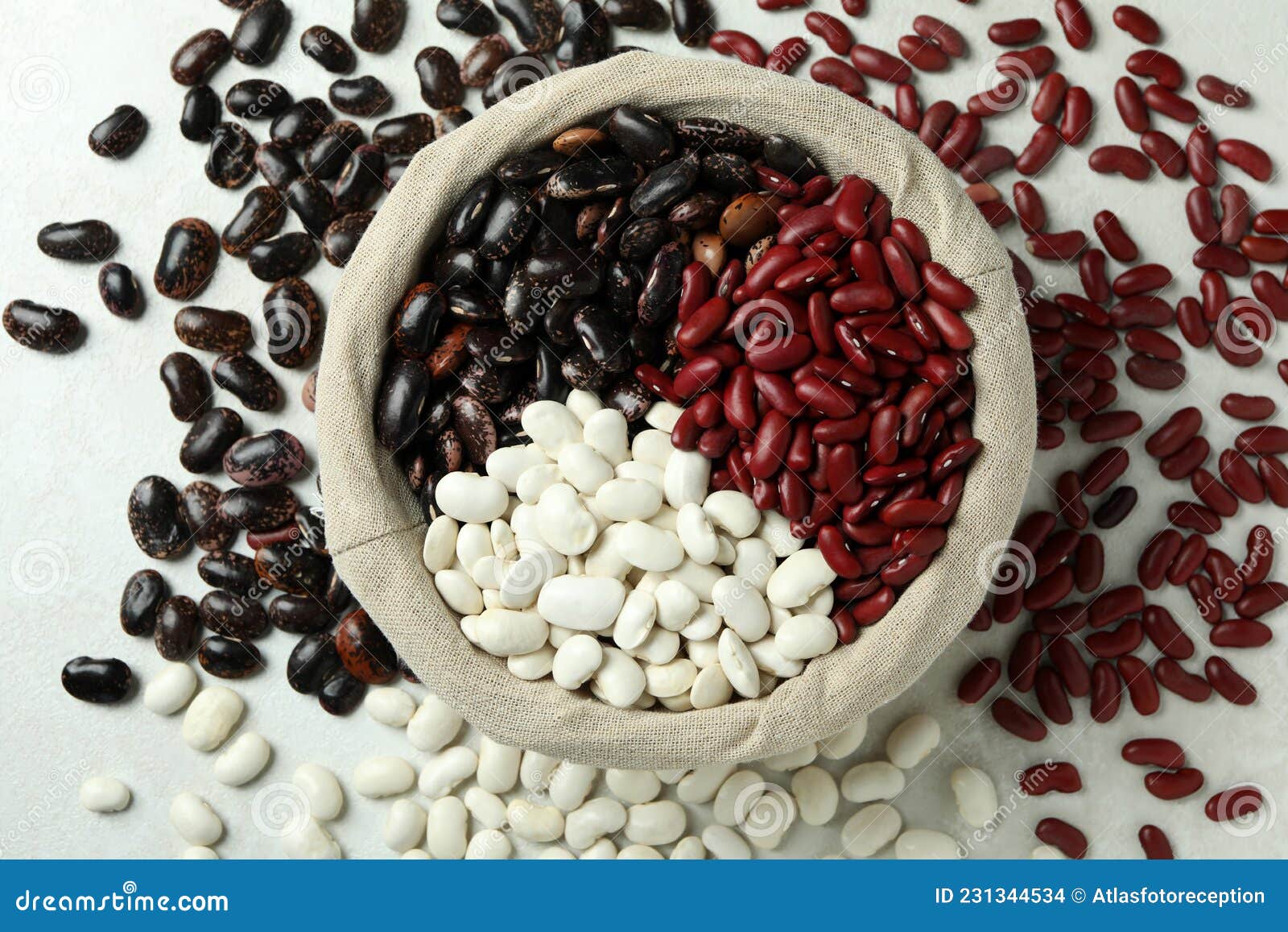 Basket with Different Types of Beans on White Textured Background Stock ...