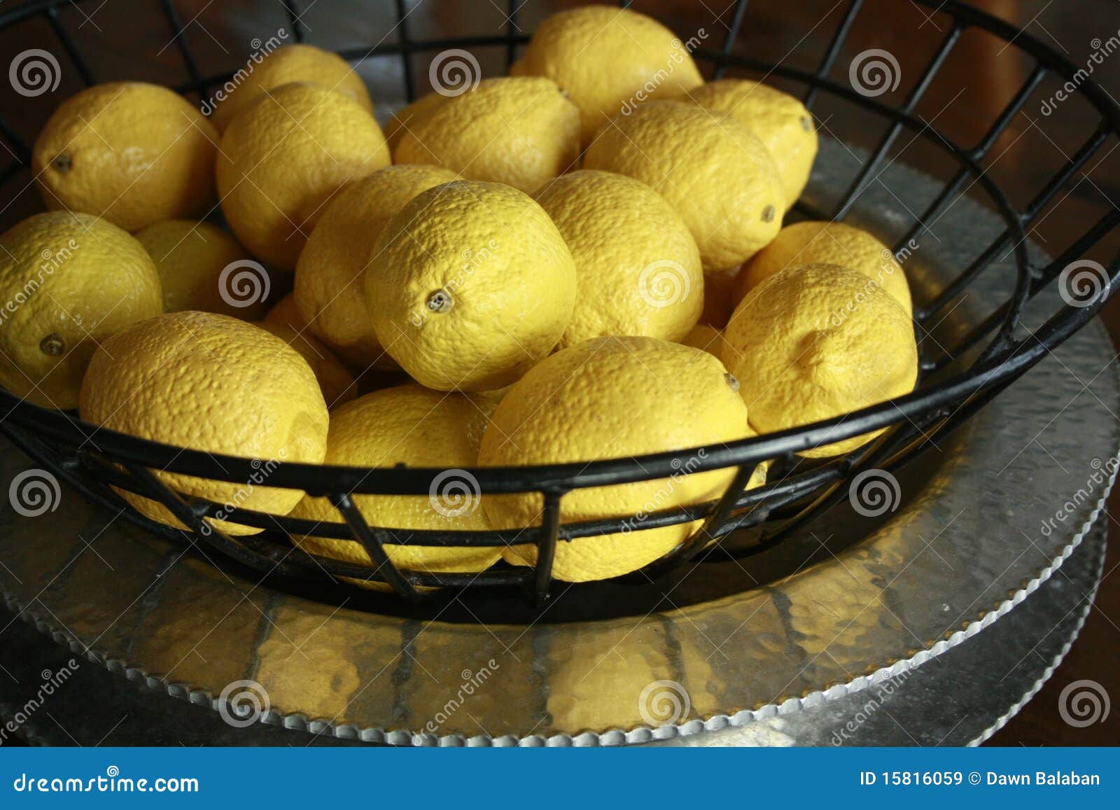 Basket of fresh lemons stock image. Image of black, lemons - 15816059