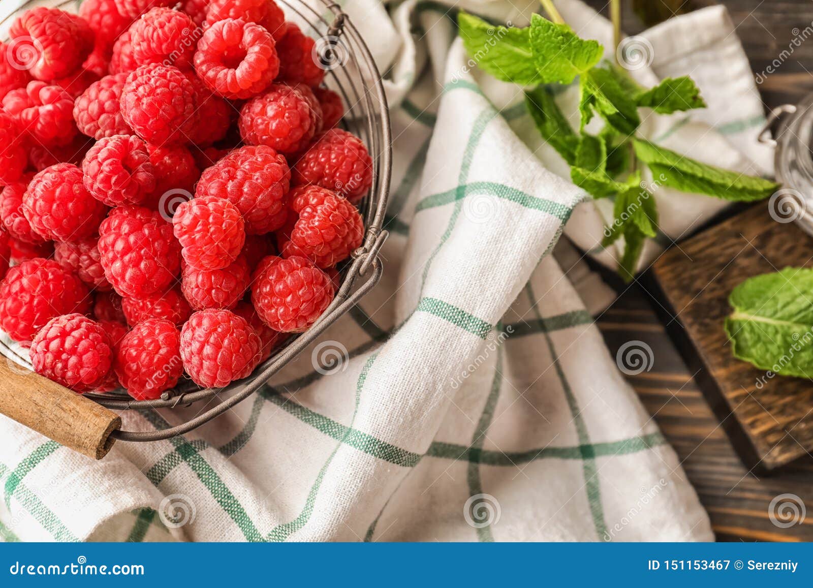 Basket with Fresh Ripe Raspberries on Table Stock Image - Image of ...