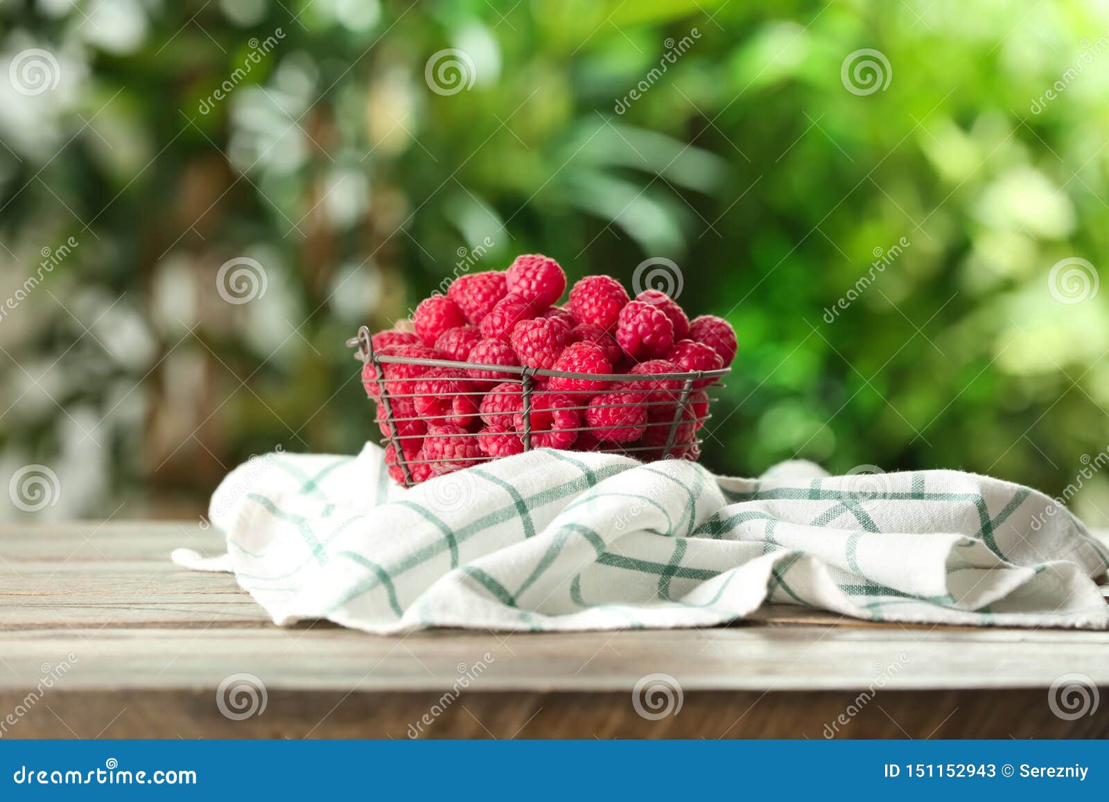 Basket with Fresh Ripe Raspberries on Table Outdoors Stock Image ...