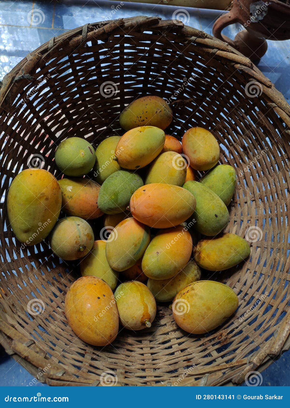 Basket full of mangoes stock image. Image of talking - 280143141