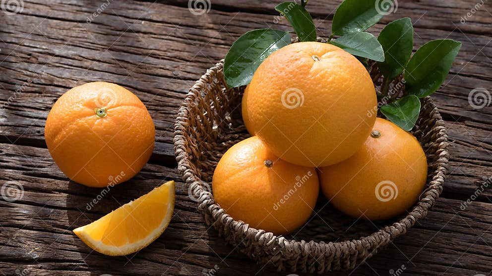 Basket of Orange Fruit Set on Wood Table Stock Photo - Image of organic ...