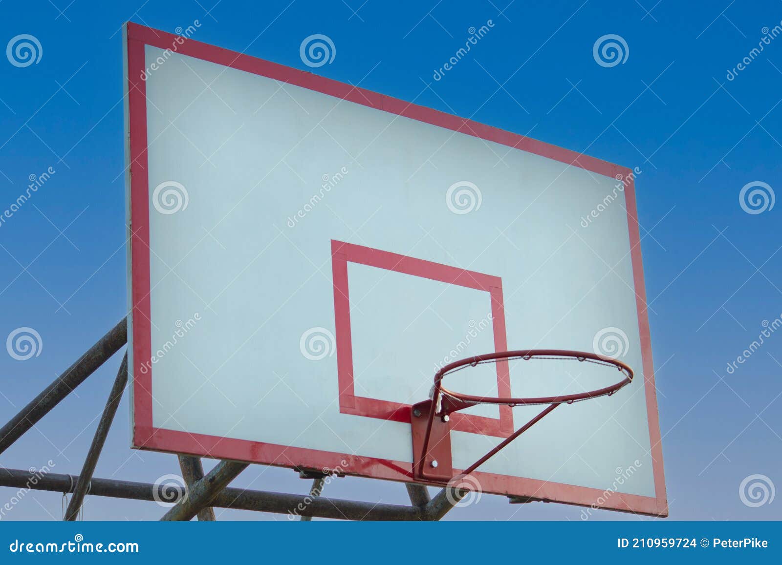 Basketball Backboard With Hoop Without Net On Blue Sky Background Stock ...