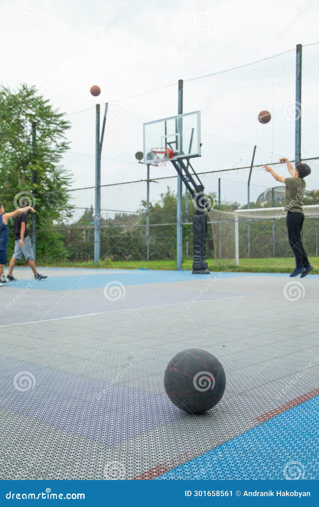 People Shooting Hoops stock image. Image of surface - 301658561