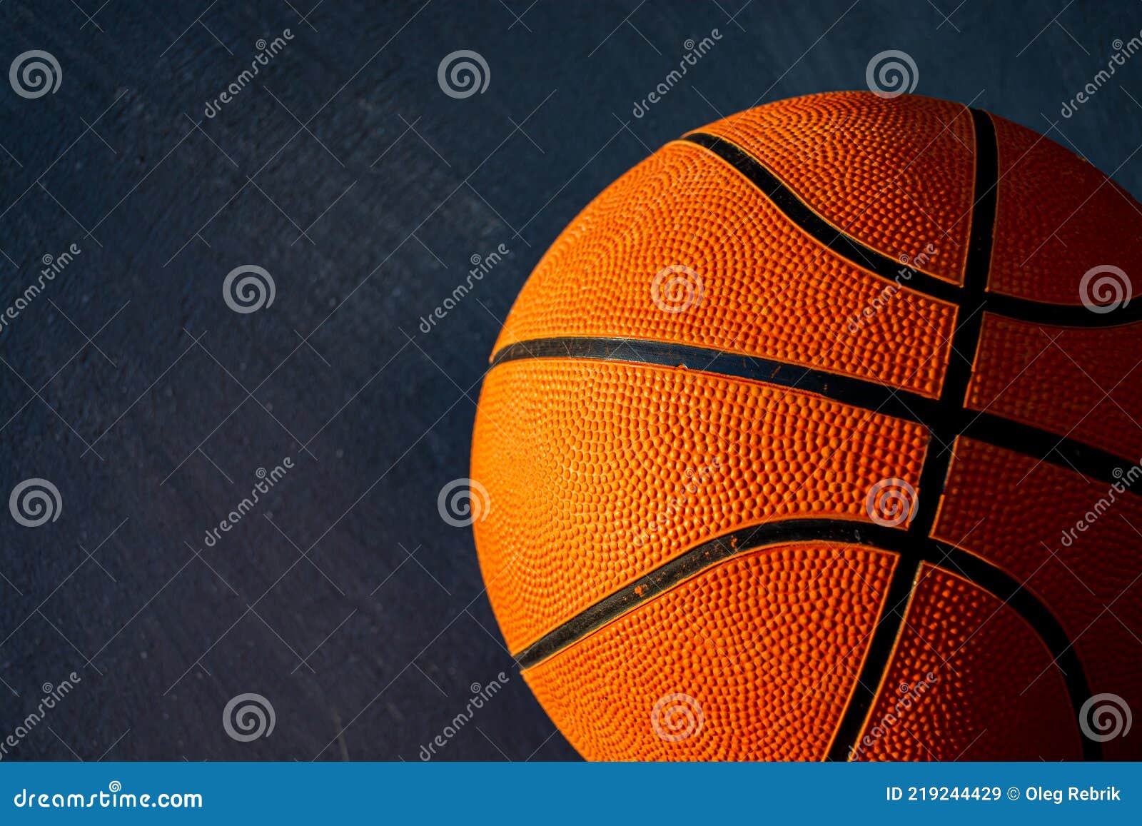 Basketball Ball Lit by Sunlight on Dark Stock Image - Image of ball ...