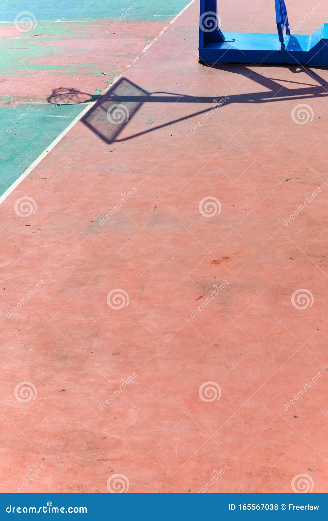 Basketball Frame and Its Shadow in an Outdoor Court Vertical ...