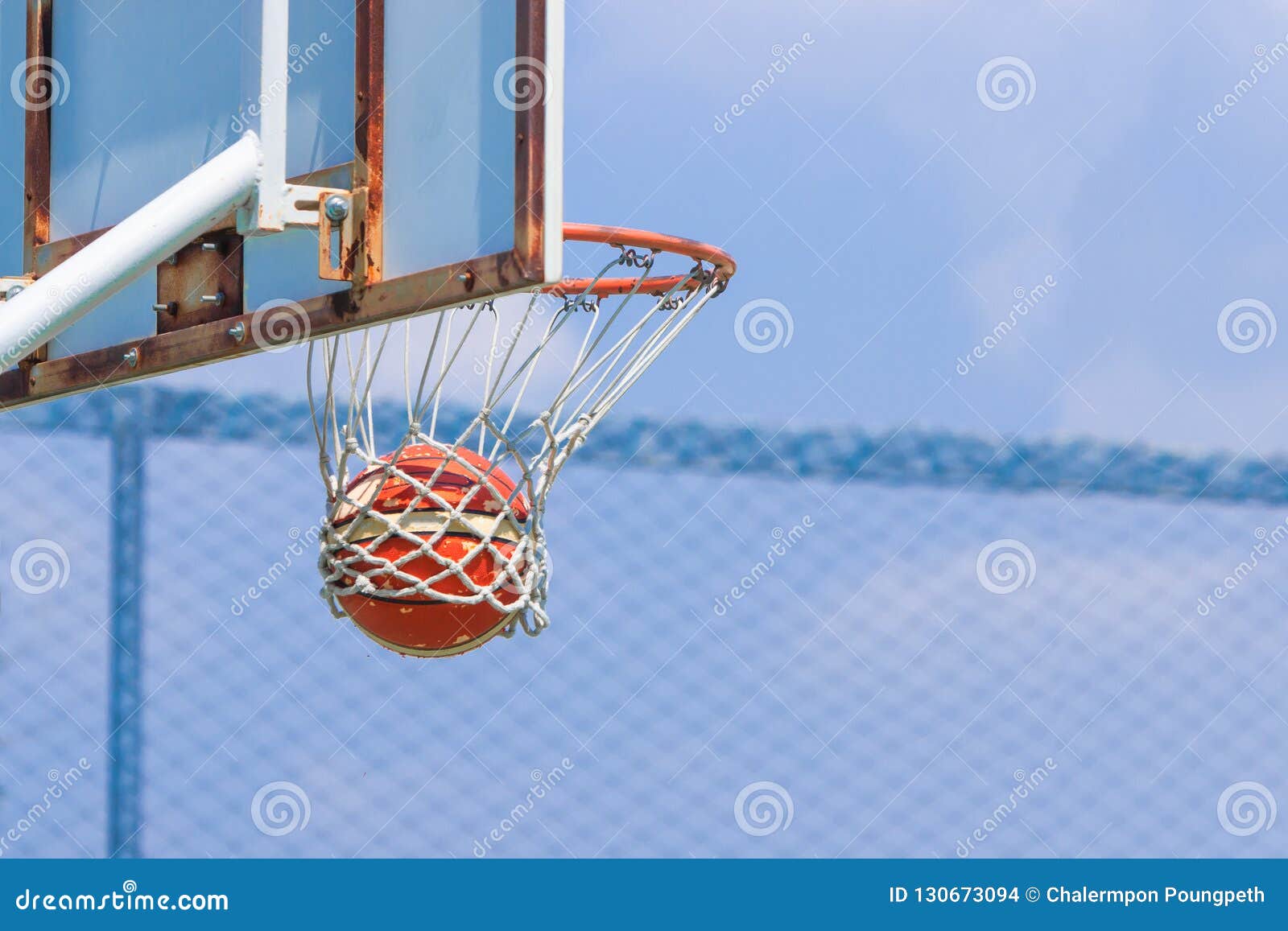 Basketball Going into the Hoop at a Local Basketball Game Stock Photo ...
