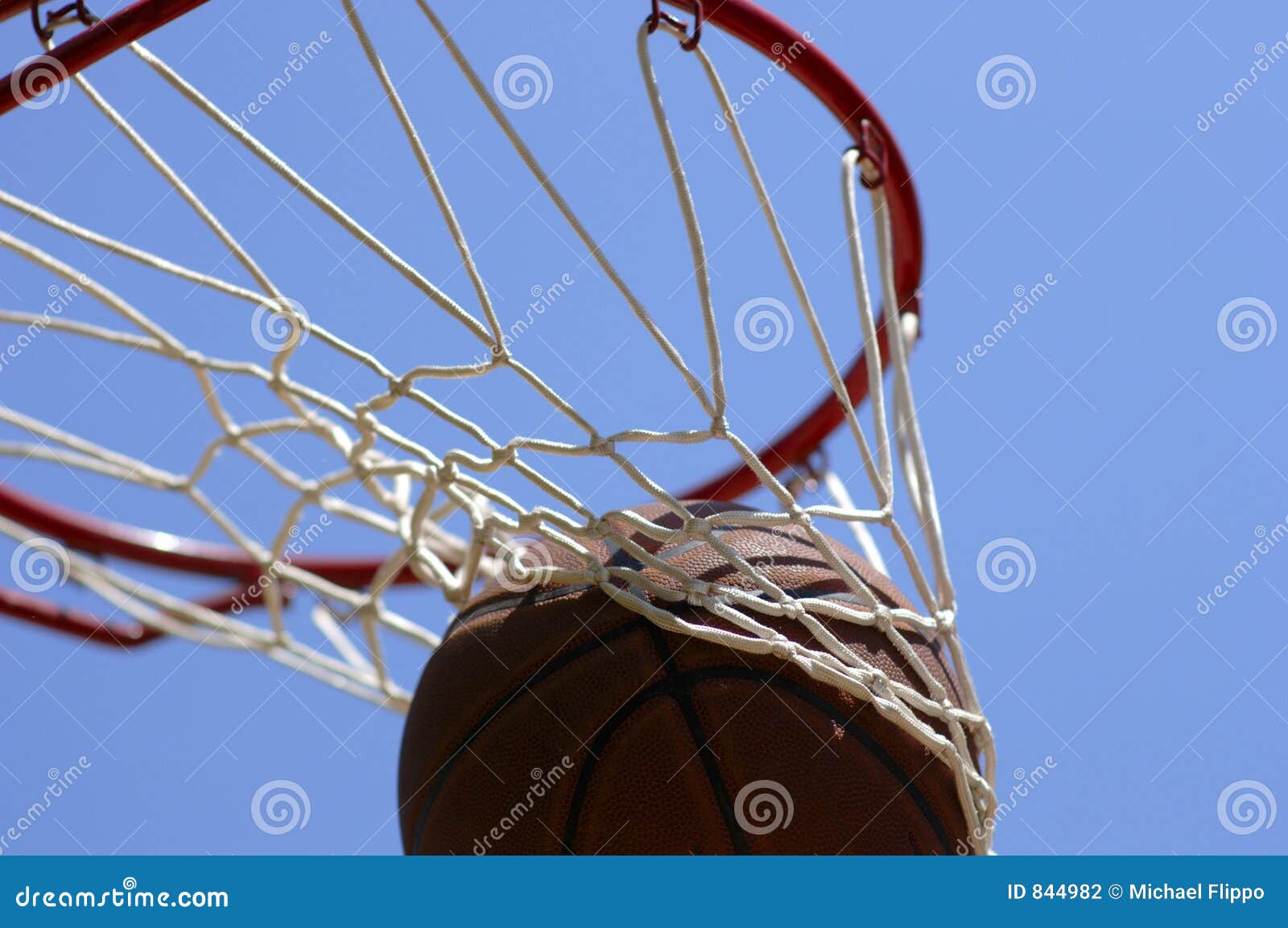 Basketball Going through Net Stock Photo - Image of basketball, basket ...