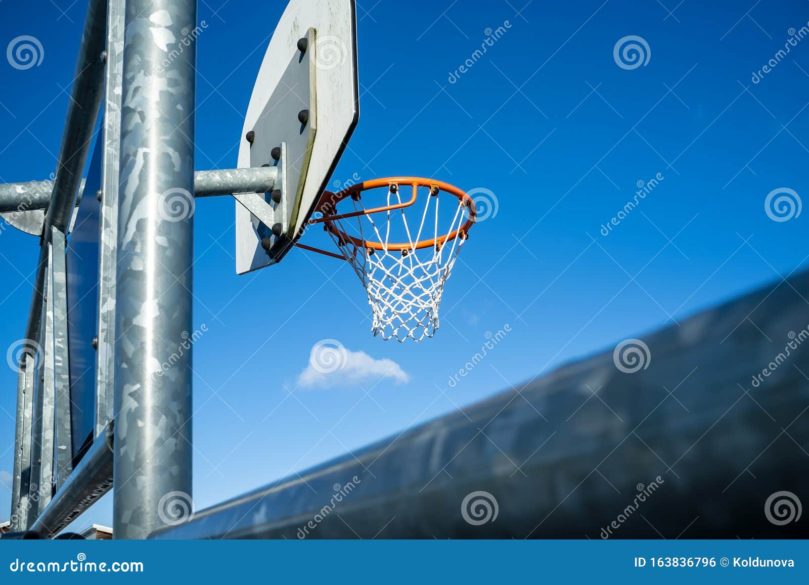 Basketball Hoop on a Background of Blue Sky. Stock Photo - Image of ...