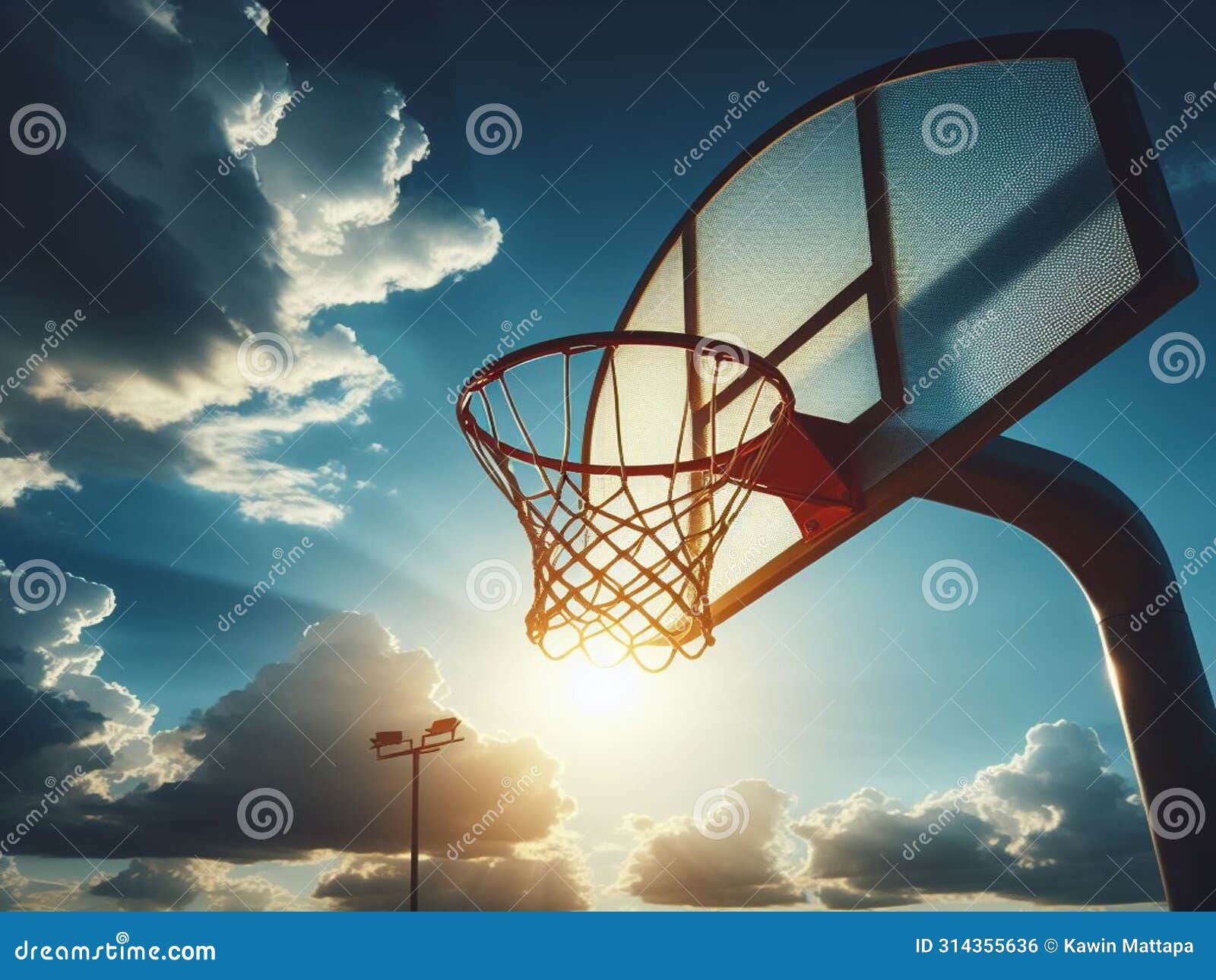 A Basketball Hoop Backlit by the Sun with a Summer Blue Sky Stock ...