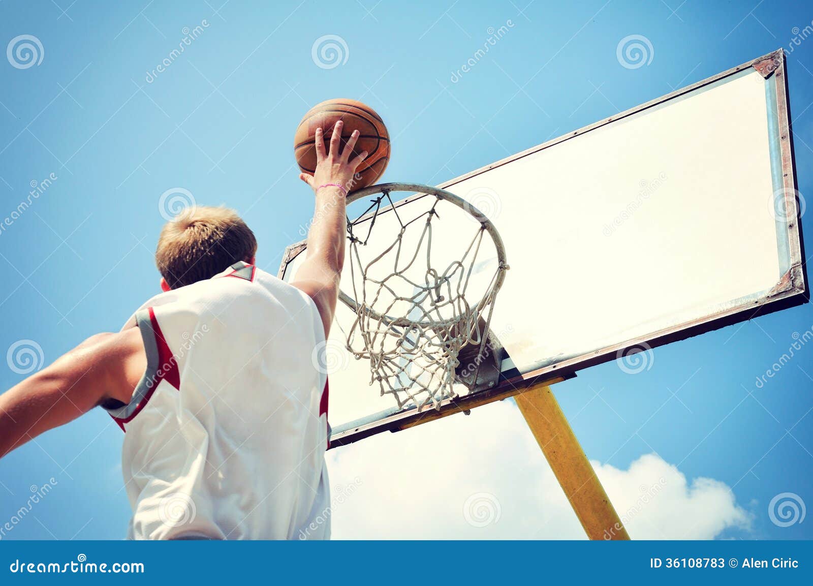 Basketball Player in Action Flying High and Scoring Stock Image - Image ...