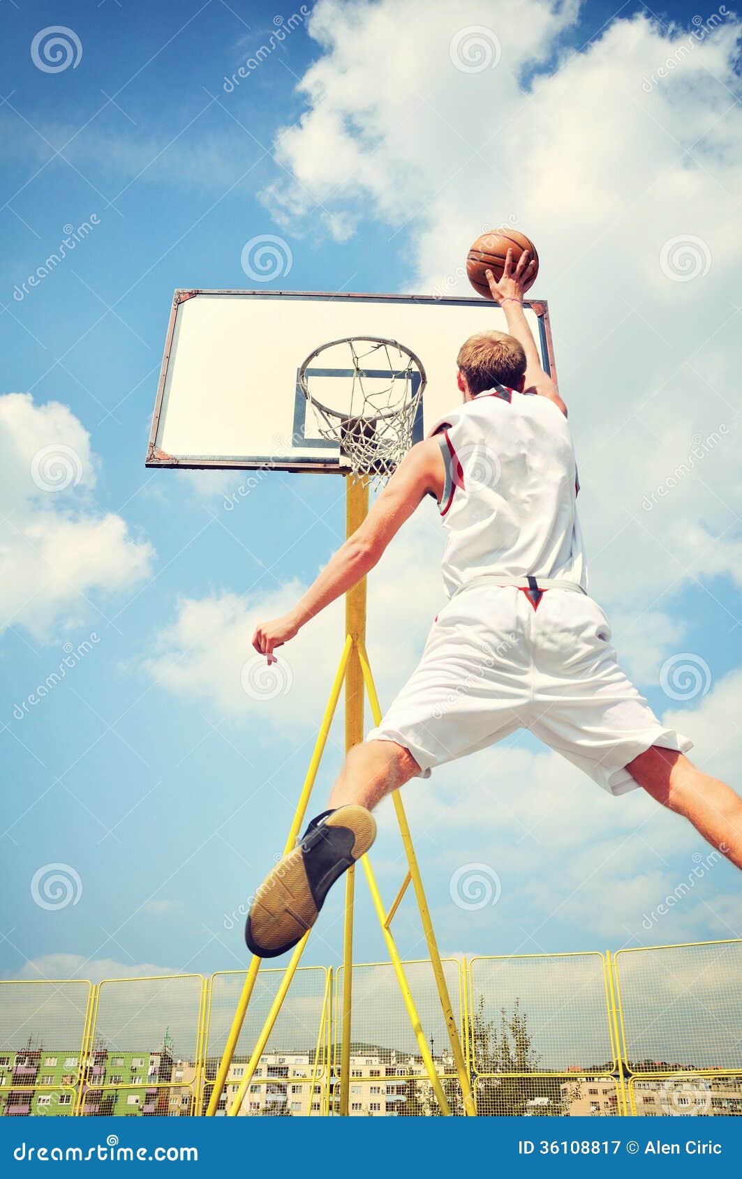 Basketball Player in Action Flying High and Scoring Stock Image - Image ...