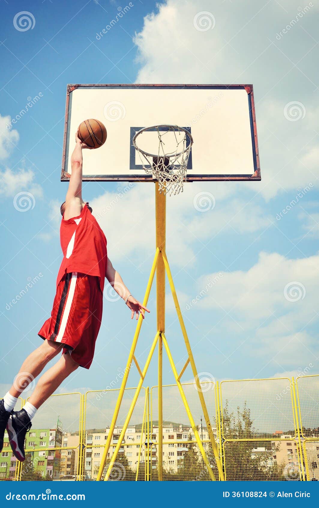 Basketball Player in Action Flying High and Scoring Stock Photo - Image ...