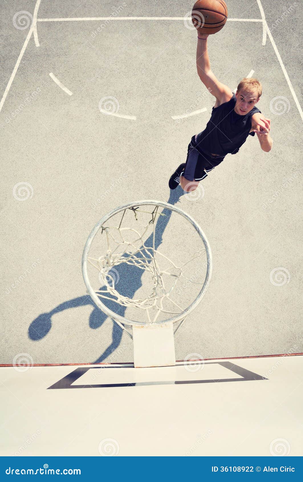 Basketball Player in Action Flying High and Scoring Stock Photo - Image ...