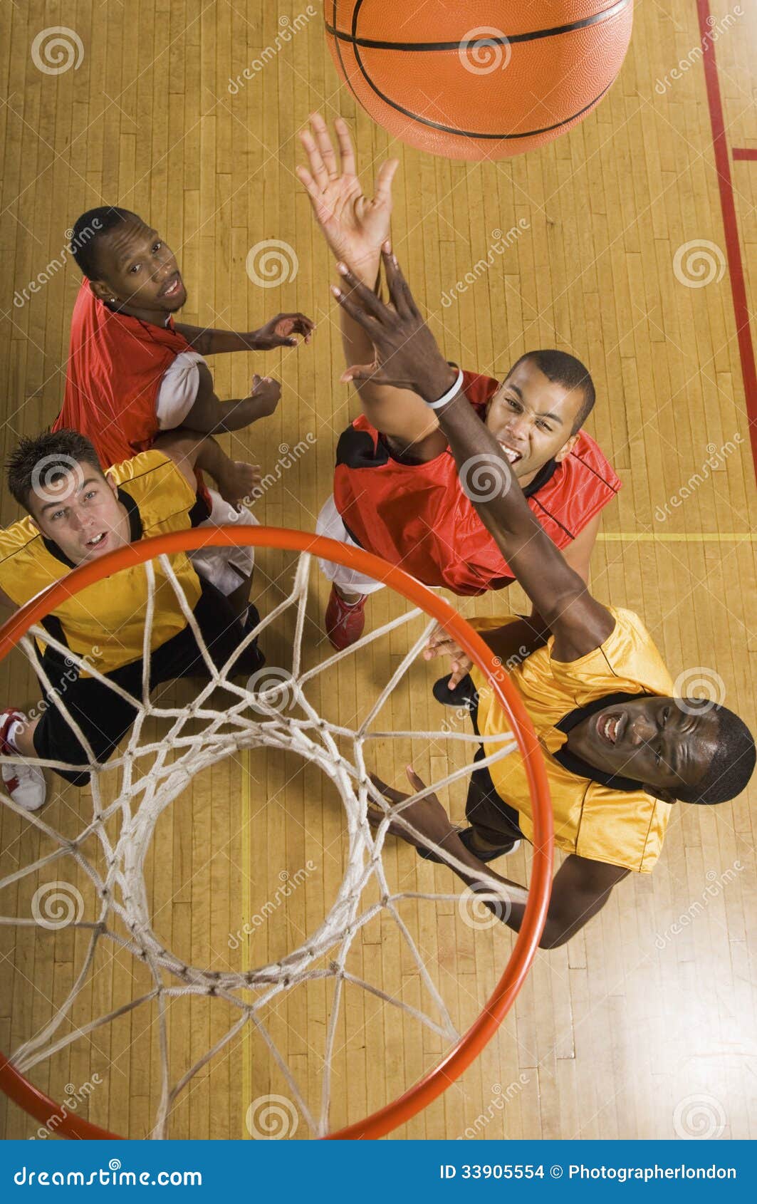 Basketball Player Attempting To Slam Dunk Ball Stock Photo - Image of ...