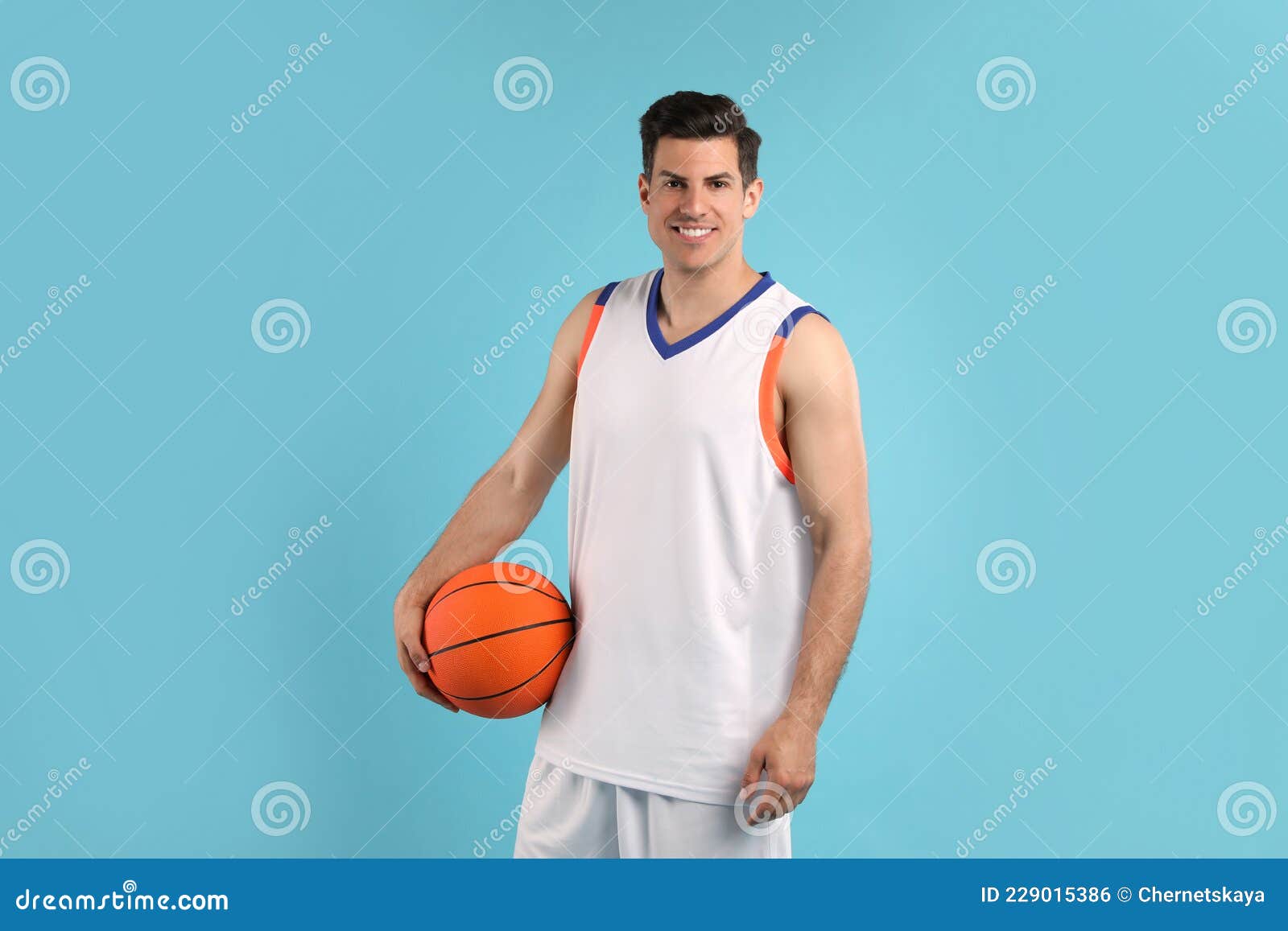 Basketball Player with Ball on Light Blue Background Stock Photo ...