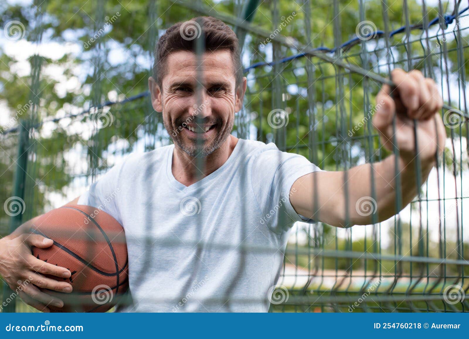 Basketball Player at Field at Sunny Daytime Stock Photo - Image of ...