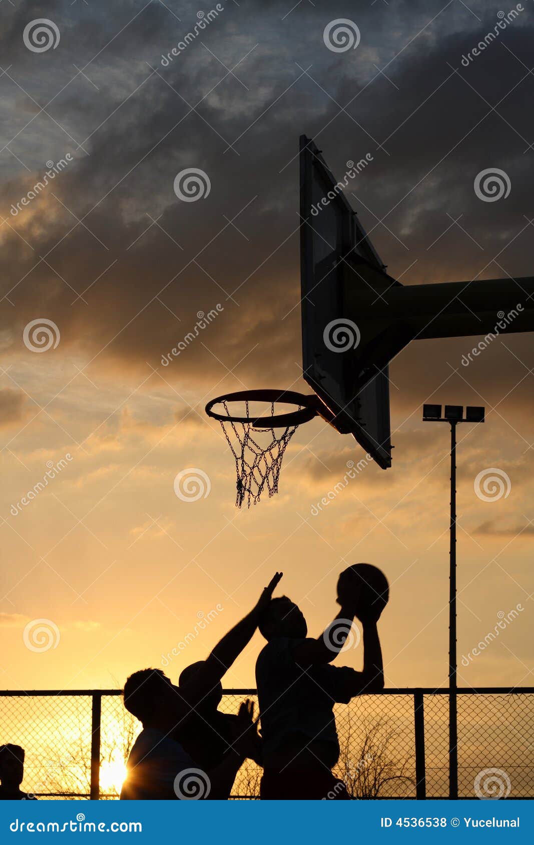 Basketball Players at the Sunset Stock Photo - Image of game, points ...