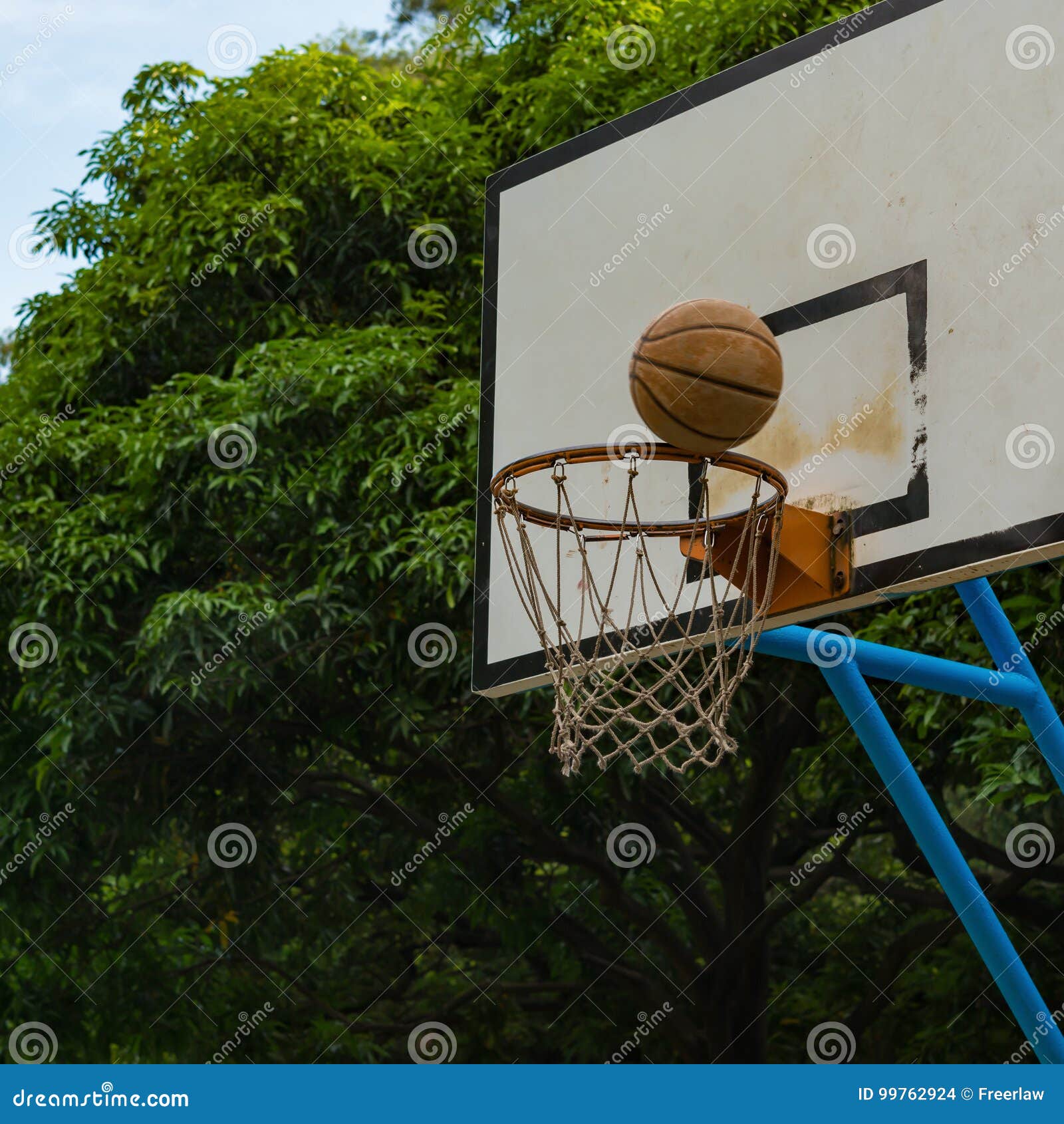 Basketball on the Rim of Hoop Stock Photo - Image of hoop, court: 99762924