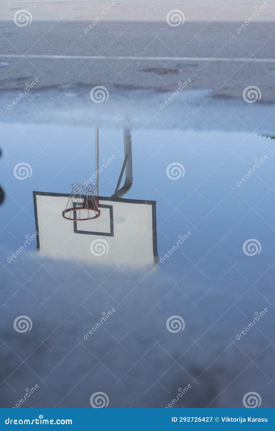 Reflection of a Basketball Ring in a Puddle after the Rain. Stock Image ...