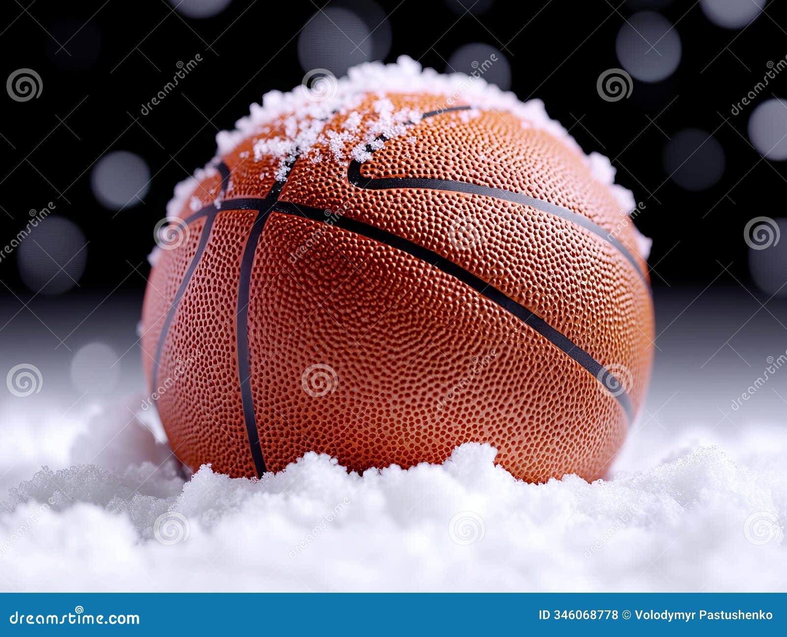 A Basketball Sitting in the Snow on a Black Background Stock Photo ...