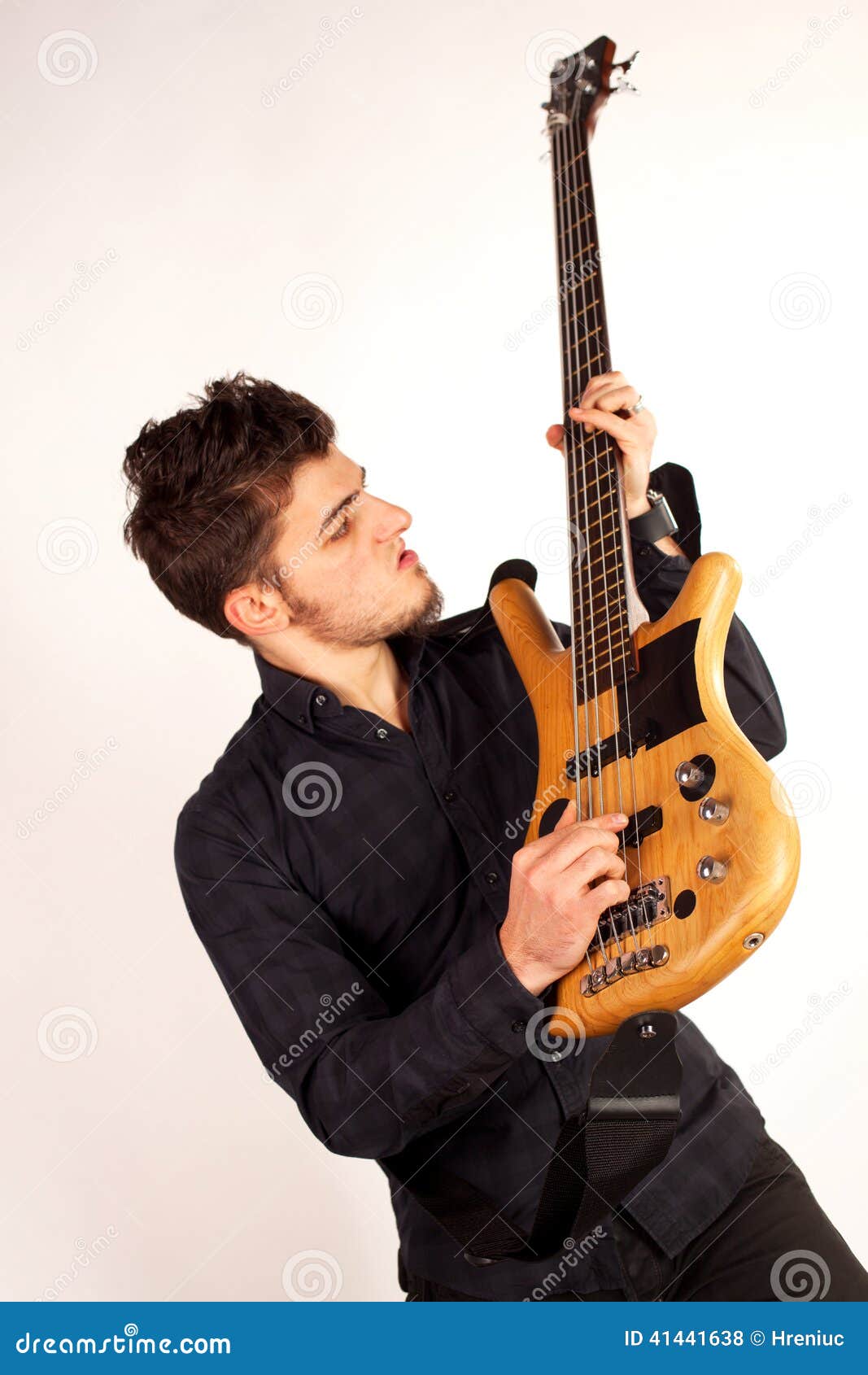 Bass Player Looking at His Instrument Stock Photo - Image of passionate ...