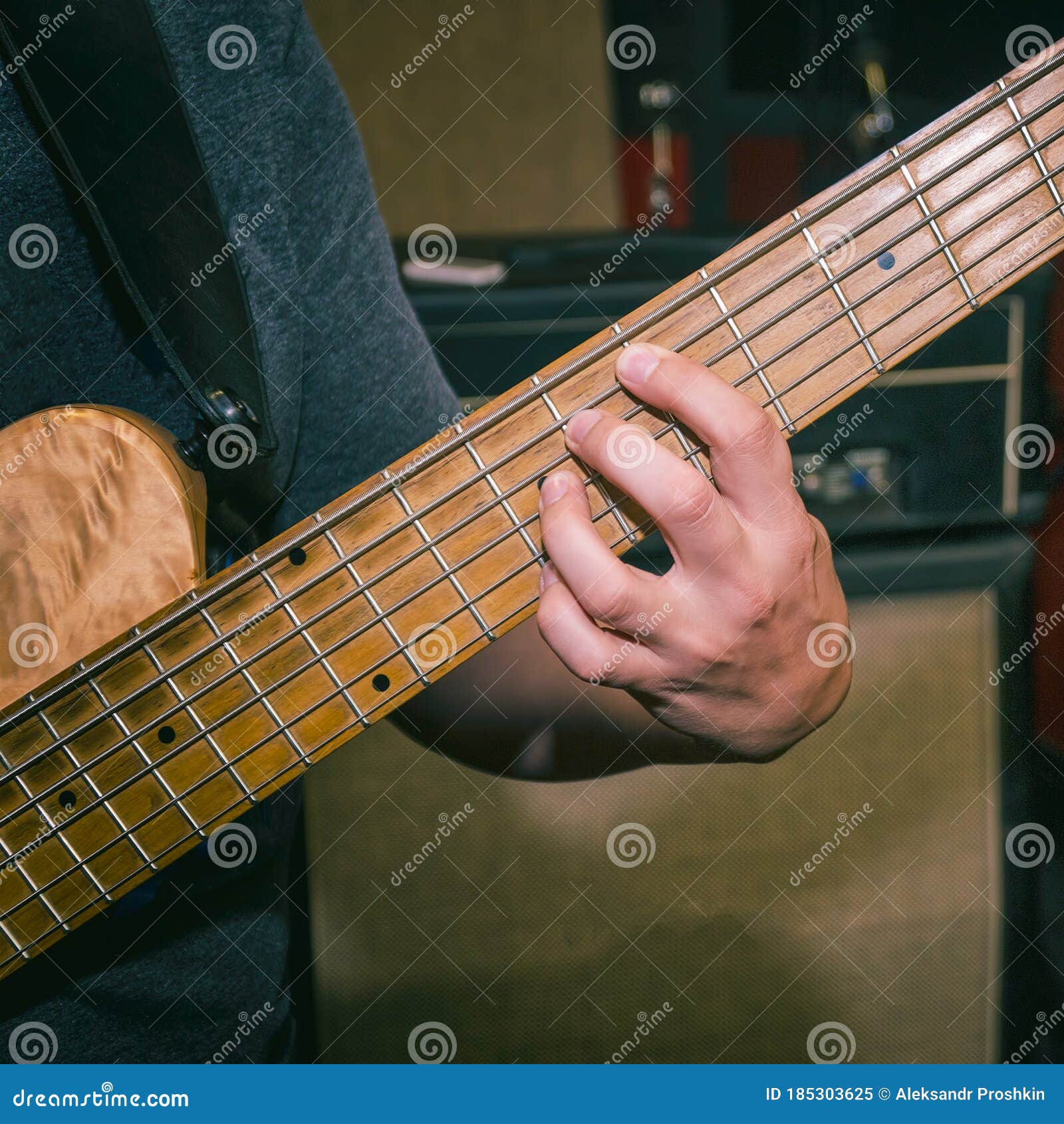 The Bass Player Plays a Five-string Bass Guitar Close-up Stock Image ...
