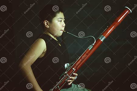 A bassoon boy stock photo. Image of color, grand, music - 17545054