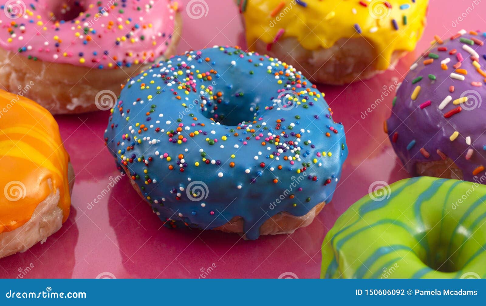 Batch of Rainbow Colored Glazed Donuts Stock Photo - Image of real ...