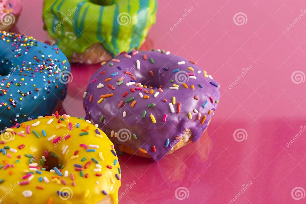 Batch of Rainbow Colored Glazed Donuts Stock Image - Image of dozen ...