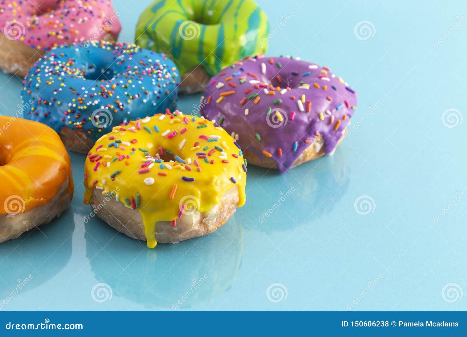 Batch of Rainbow Colored Glazed Donuts Stock Photo - Image of copy ...