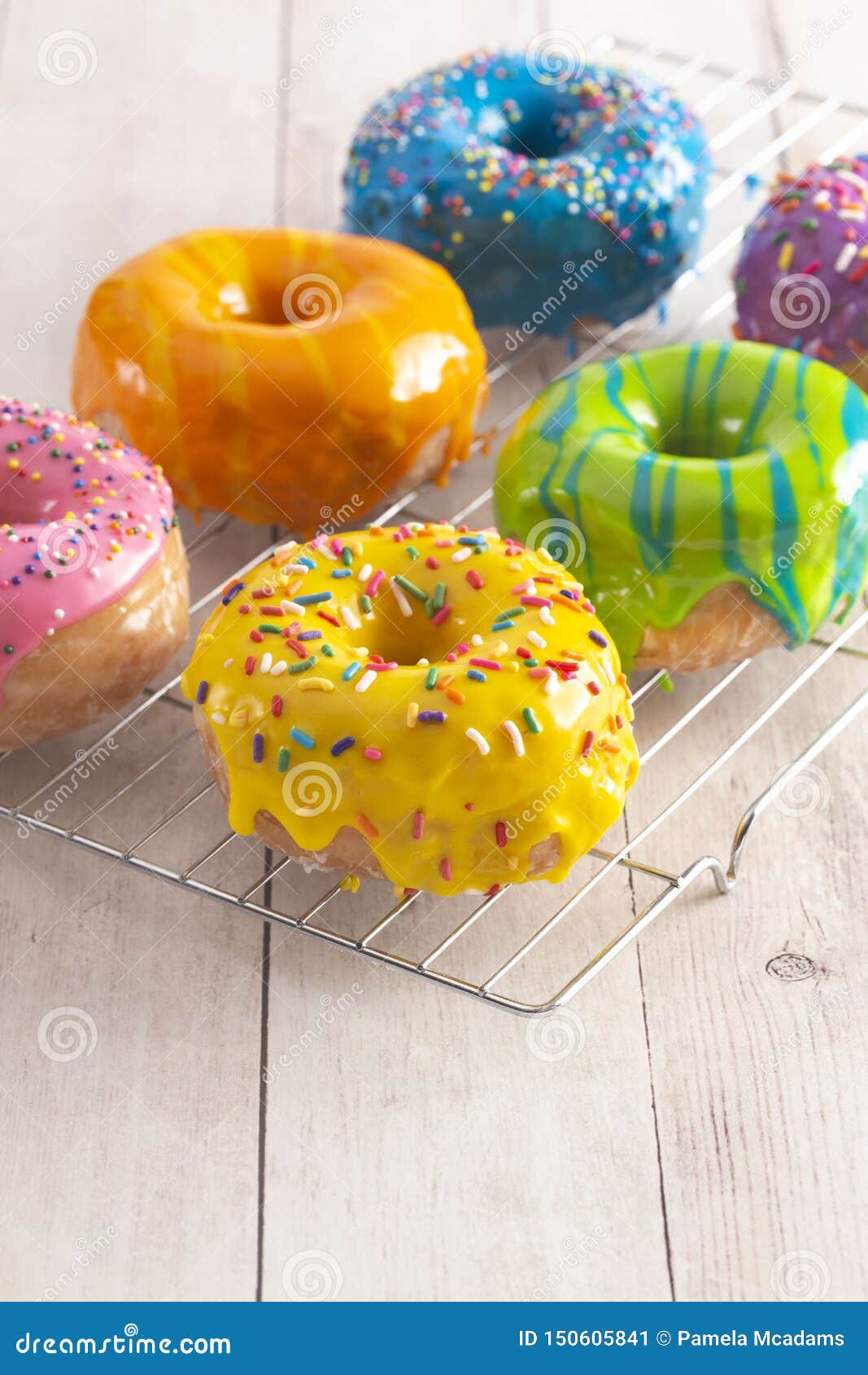A Batch of Rainbow Donuts on a White Wood Table Stock Image - Image of ...