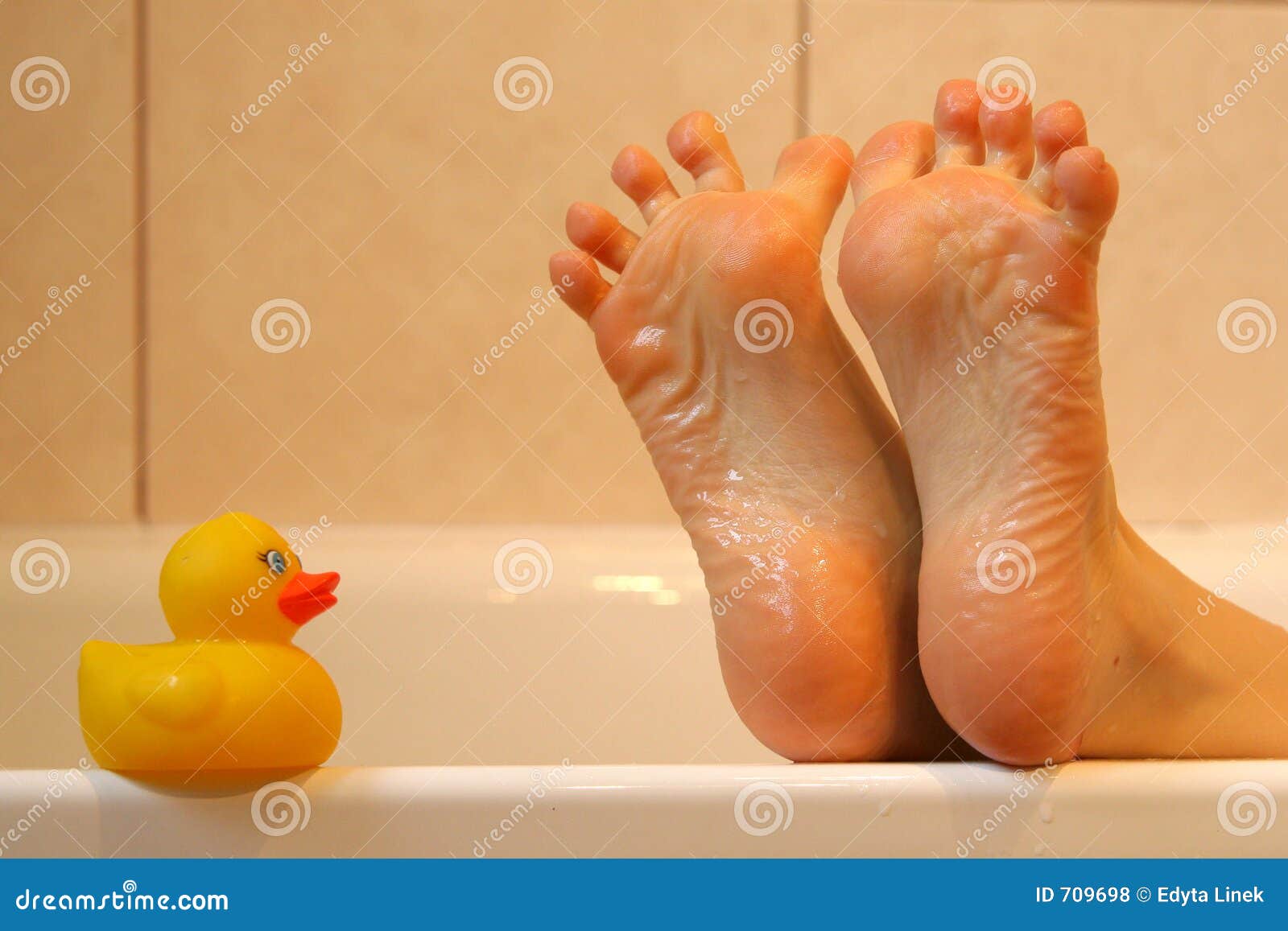 Bath duck meeting feet stock photo. Image of relax, play - 709698