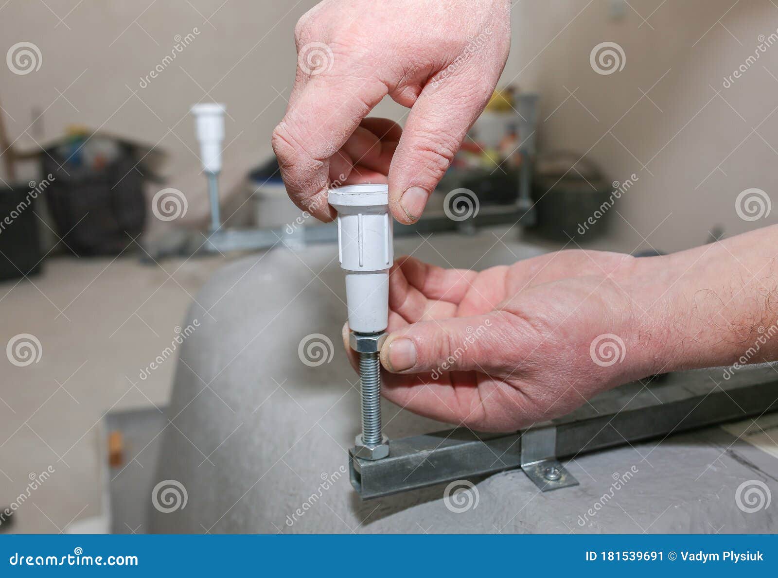 Bath Installation. Worker is Making Fastener. Maintenance Repair in the ...