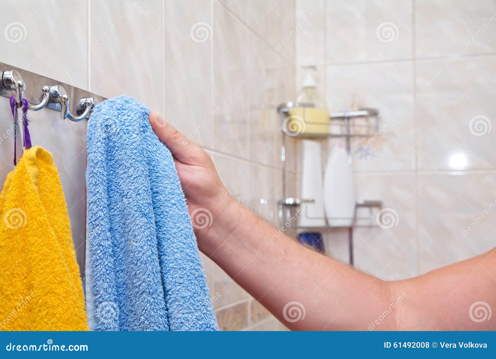 Bath towel in his hand man stock photo. Image of apartment - 61492008
