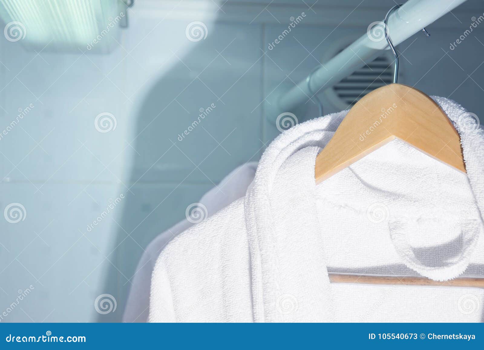 Bathrobe hanging on rack stock image. Image of relaxation - 105540673
