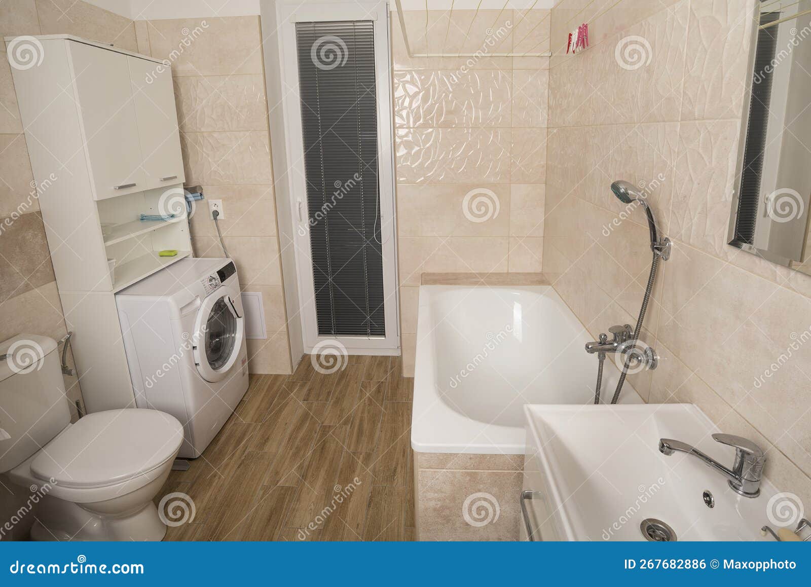 Bathroom with a Washing Machine Bathtub and Toilet Stock Photo - Image ...