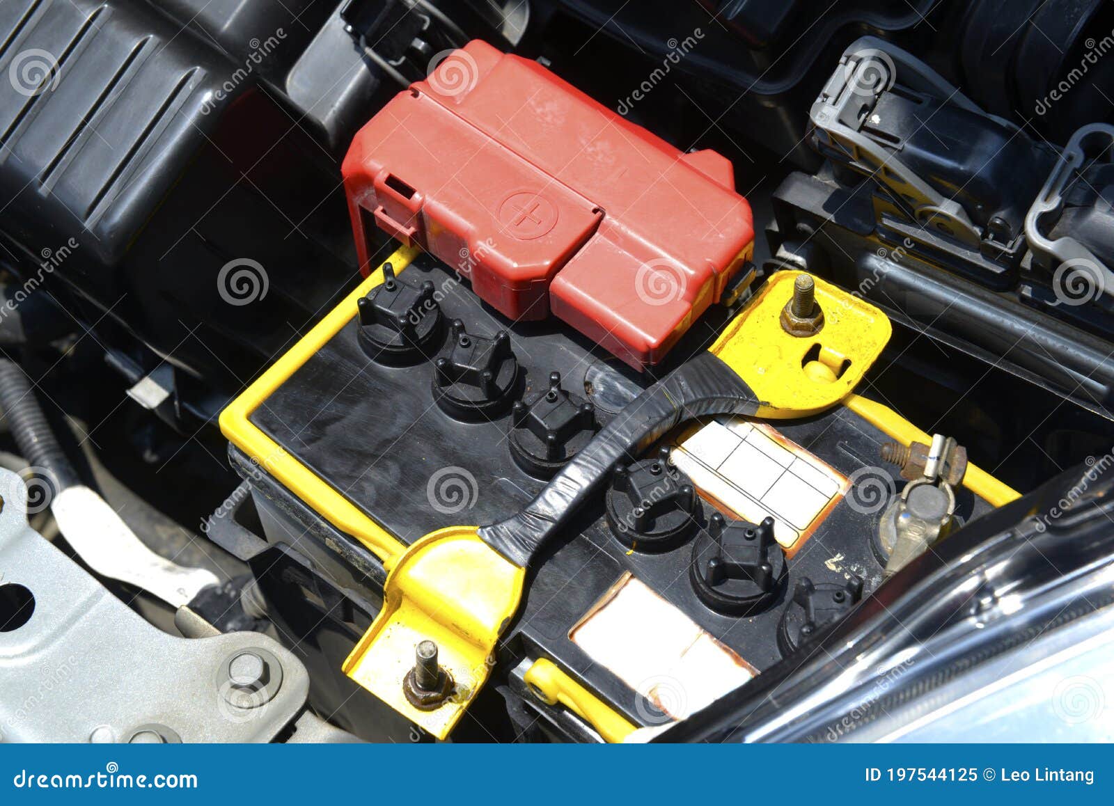The battery in the car stock image. Image of device - 197544125