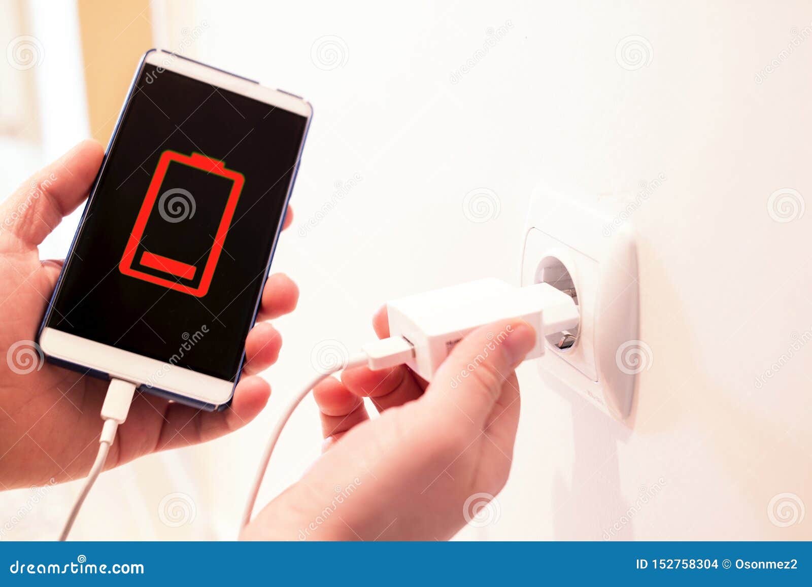 Battery Out of Phone. Phone Charging from a Wall Outlet Stock Photo ...