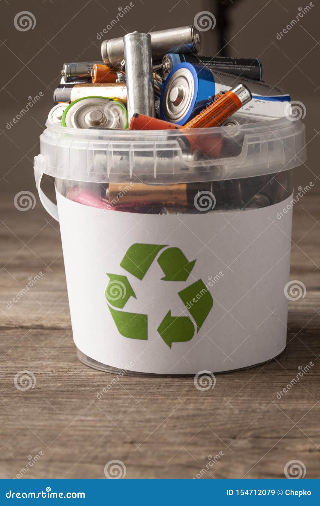 Battery Recycle Bin with Old Element on Wood Table Stock Image - Image ...