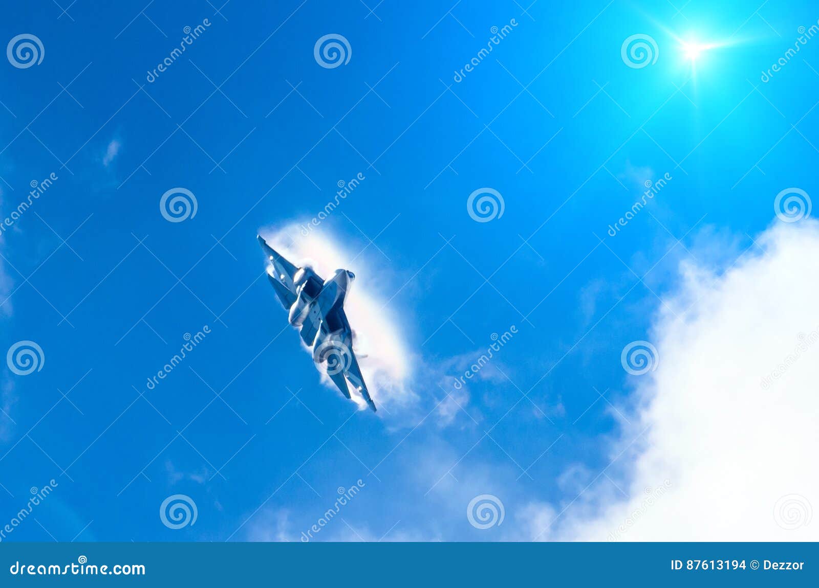 Battle Fighter Jet Flying Dives Breaking Clouds on a Blue Sky Sun Light ...