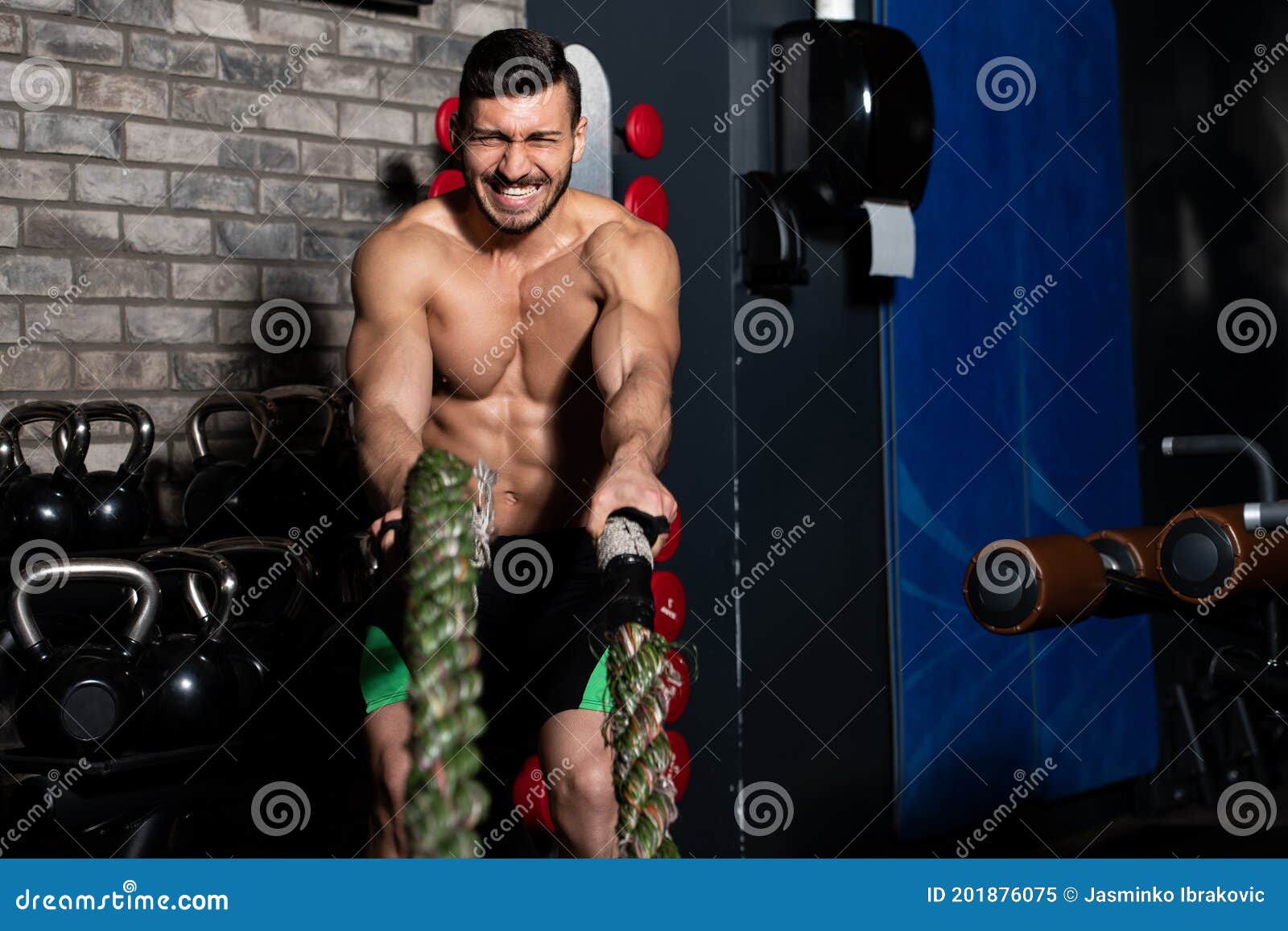Young Man Battling Ropes at Gym Workout Exercise Stock Image - Image of ...