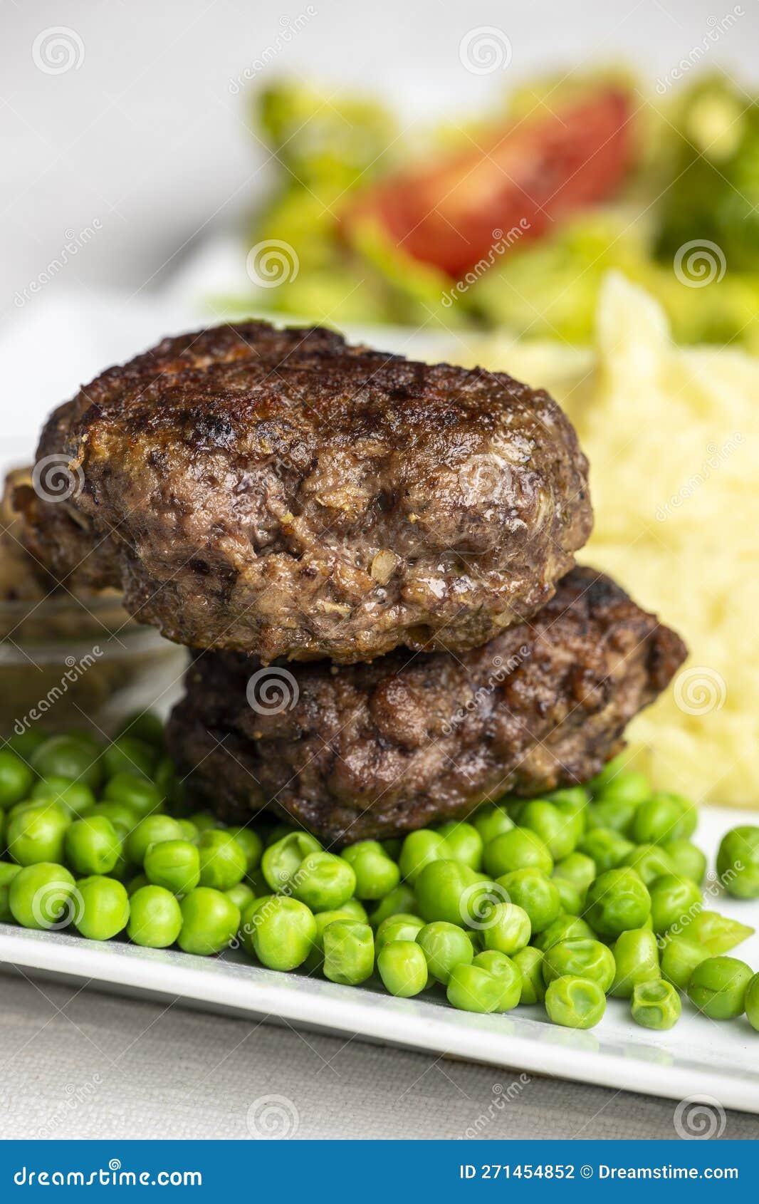 Meat Loafs In The Form Of Pillars Around A Heap With Crisp White Rice ...