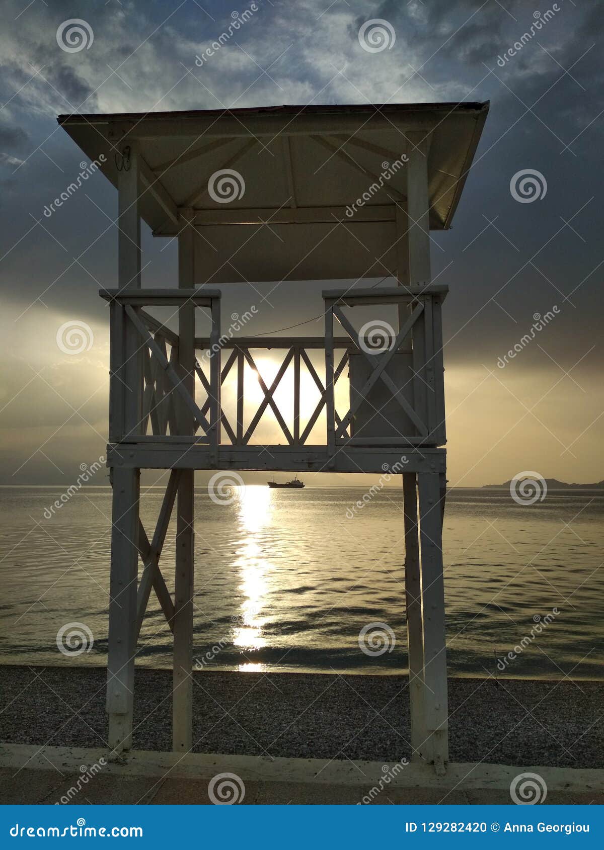 Baywatch tower in Greece stock photo. Image of sunset - 129282420