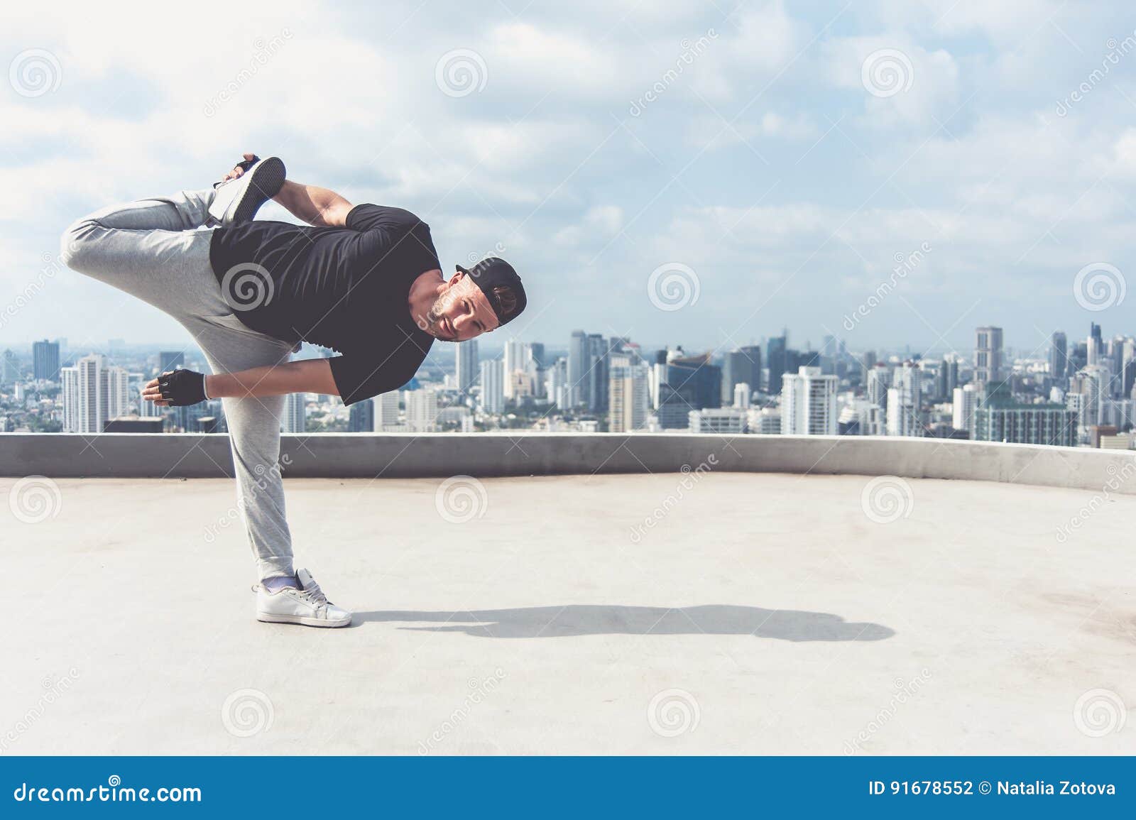 Bboy Doing Some Stunts. Street Artist Breakdancing Outdoors Stock Photo ...
