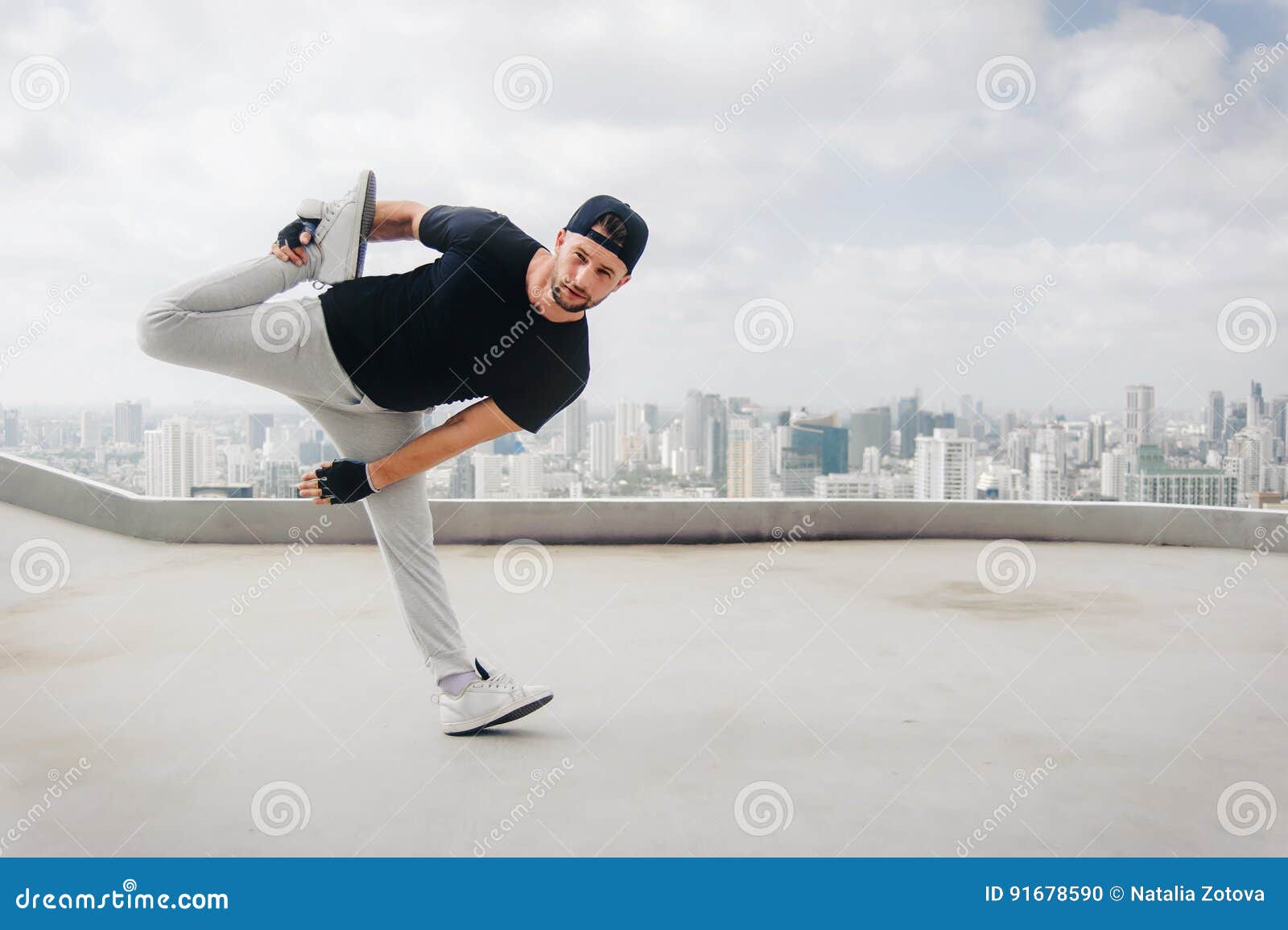 Bboy Doing Some Stunts. Street Artist Breakdancing Outdoors Stock Photo ...